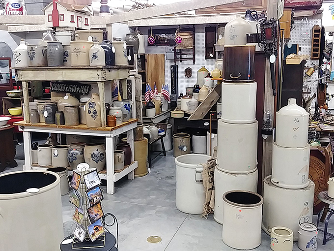 A treasure hunter's paradise! Rows of vintage stoneware crocks and jugs stand at attention like ceramic soldiers waiting to be drafted into service in a modern home.