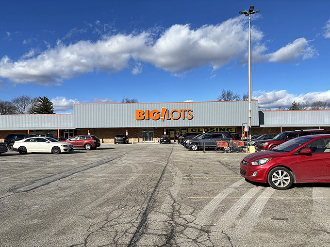 The iconic orange Big Lots sign stands proud against a blue Ohio sky, beckoning bargain hunters like a retail lighthouse guiding ships to shore.
