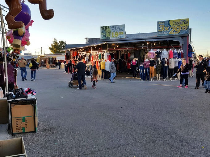 Rows of colorful clothing stretch into the distance as shoppers hunt for deals. The thrill of the bargain chase is palpable in the Arizona sunshine.