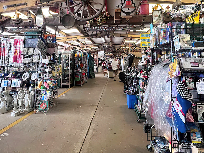Treasure hunters navigate the endless aisles of Traders World, where wagon wheels overhead watch shoppers hunt for bargains below.
