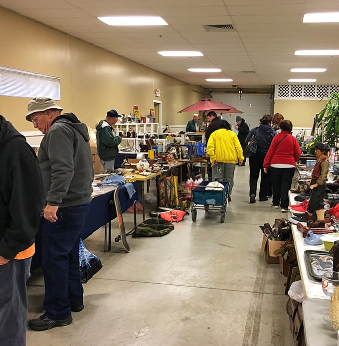 Treasure hunters navigate the indoor aisles at Berea Flea Market, where one person's forgotten knickknack becomes another's prized possession.