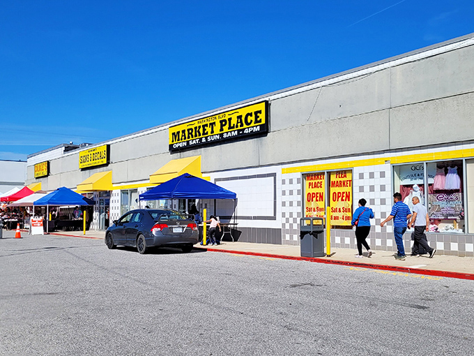 The bright yellow signage of Washington Boulevard Marketplace beckons like a lighthouse for treasure hunters. Weekend warriors, your bargain paradise awaits!