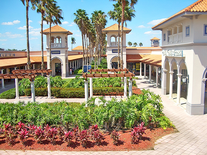Mediterranean elegance meets retail therapy at Florida Keys Outlet Marketplace, where palm trees stand guard over shopping paradise.