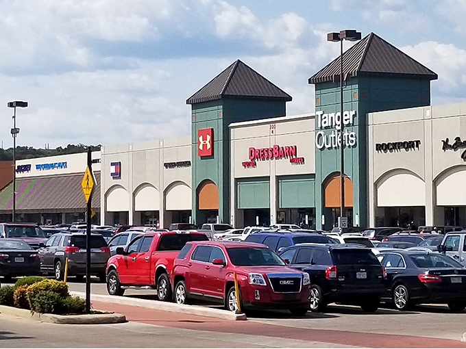 The iconic teal towers of Tanger Outlets welcome bargain hunters like beacons of hope in a sea of retail possibilities.