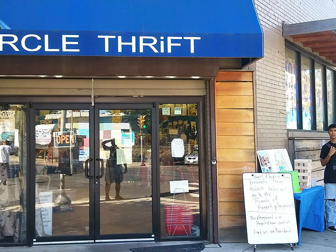 The iconic blue awning of Circle Thrift stands out like a beacon of bargain hope on Philadelphia's urban landscape. Treasure hunters, your destination awaits!