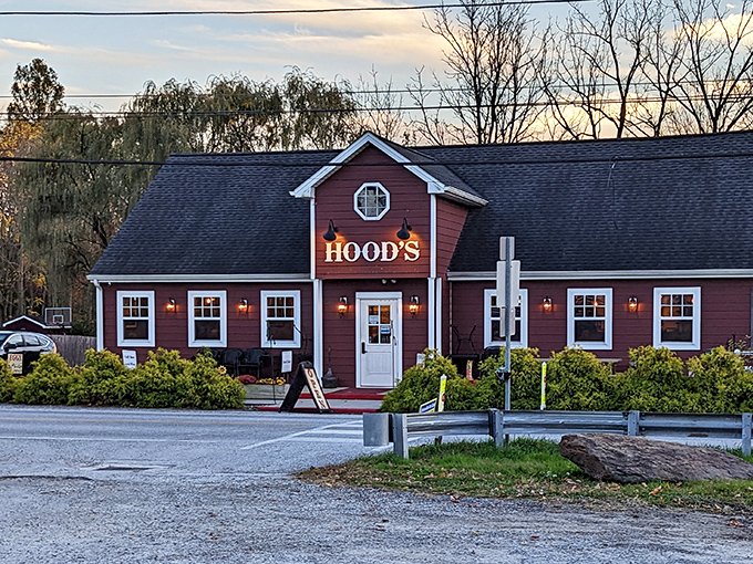 The red barn-like exterior of Hood's BBQ stands as a beacon of smoky promise against the Pennsylvania sky.
