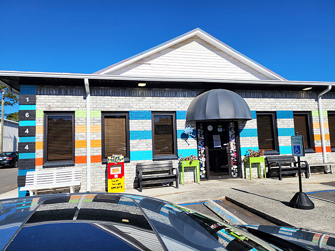 The colorful exterior of Early Bird Diner beckons like a rainbow after a Charleston rainstorm. Those vibrant stripes aren't just decoration&mdash;they're a promise of the personality waiting inside.