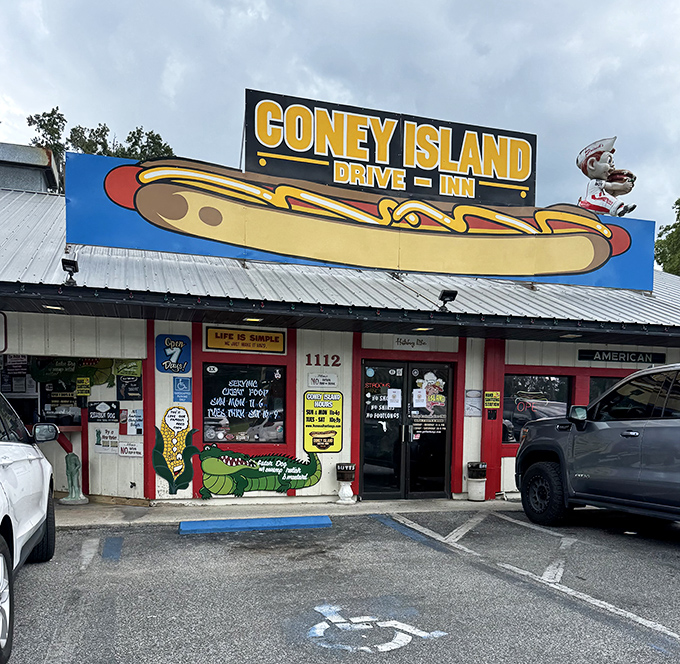 Step inside and you've entered a museum where nostalgia isn't behind glass&mdash;it's plastered on every available surface. The red ceiling adds that perfect diner glow.