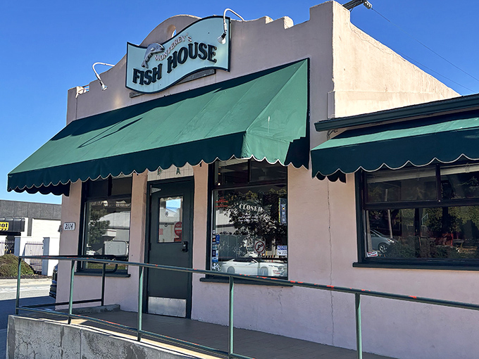 The unassuming pink exterior hides culinary treasures within. Like finding a pearl in an oyster, this modest building houses seafood magic