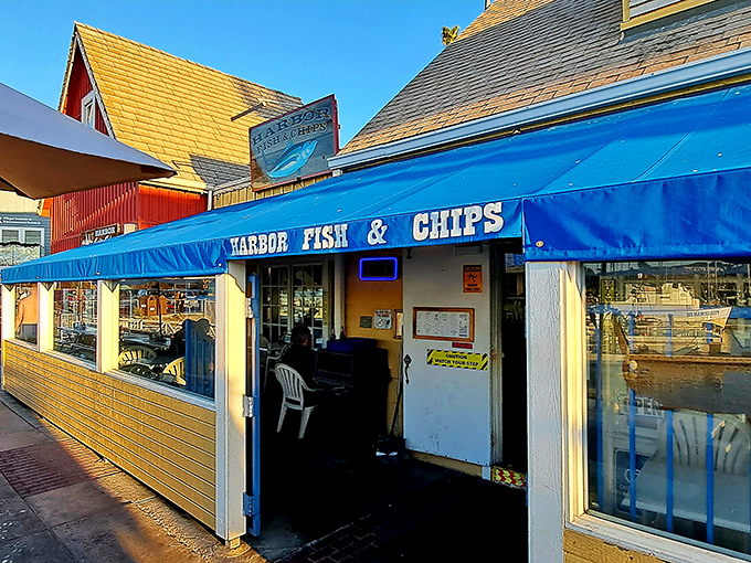 The iconic blue awning of Harbor Fish & Chips stands as a beacon for seafood lovers, promising simple pleasures done extraordinarily well.
