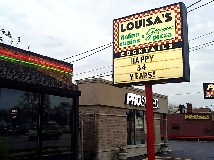 The iconic red-and-white checkered sign beckons pizza pilgrims like a lighthouse guiding hungry sailors home. Simplicity on the outside, magic within.