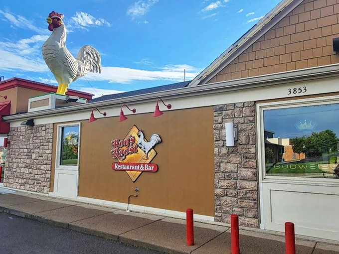 The legendary rooster stands guard atop Ron's Roost, a beacon of comfort food that's been clucking Cincinnati's language of deliciousness for generations.