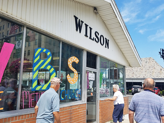 The unassuming white exterior of Wilson's Sandwich Shop stands as a beacon of culinary constancy in downtown Findlay, where flavor trumps flash every time.
