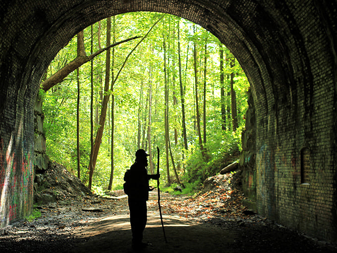 The entrance to Moonville Tunnel stands like a portal to another dimension, where graffiti meets history in a haunting embrace.