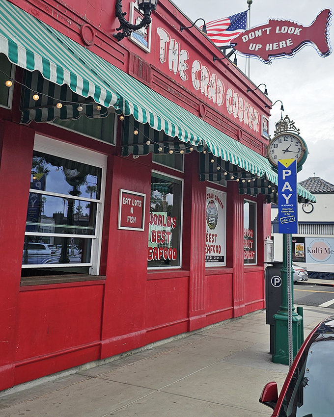 The iconic fire-engine red exterior of The Crab Cooker, complete with its famous "DON'T LOOK UP HERE" fish sign, stands as Newport Beach's seafood beacon.
