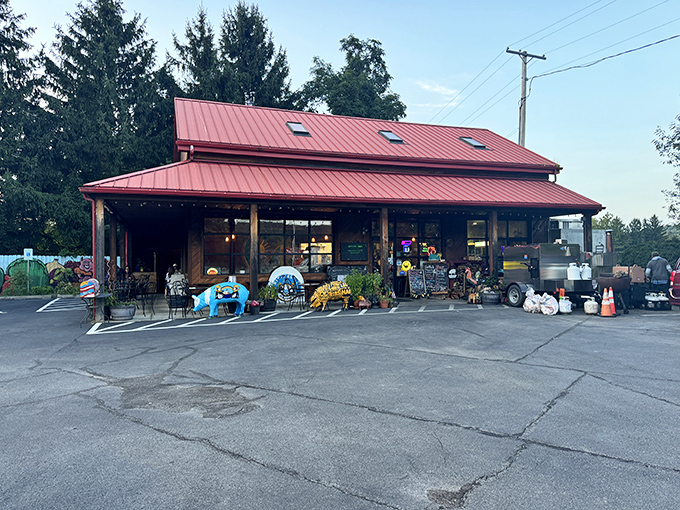 The red metal roof of Mitch's BBQ stands like a beacon to hungry travelers, promising smoky delights within this unassuming Warrendale treasure.