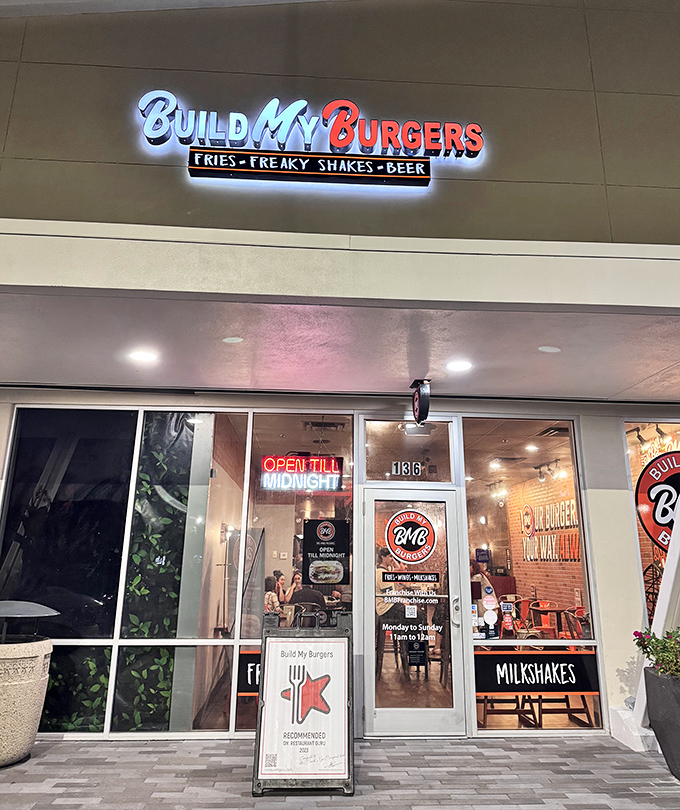 The neon glow of Build My Burgers beckons like a lighthouse for the hungry. Open till midnight for those emergency burger situations we all face.