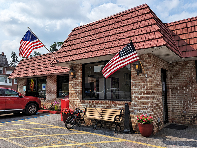 The iconic red-roofed brick building with American flags proudly waving says everything you need to know&mdash;comfort food and patriotism served in equal measure.