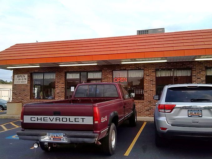 The unassuming brick exterior with its signature orange-red roof has been Florence's best-kept culinary secret for decades. No Instagram filters needed here—just honest food and community.