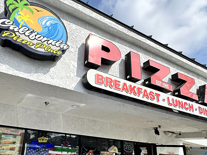 The unassuming storefront where pizza dreams come true. California Pizza Place's retro sign promises three daily opportunities for deliciousness.