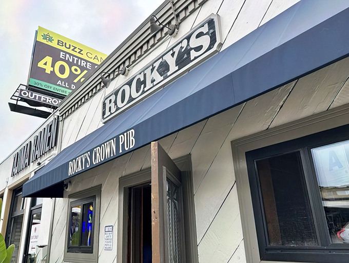 The unassuming exterior of Rocky's Crown Pub hides San Diego's burger royalty behind a modest blue awning. Culinary treasures often come in humble packages.