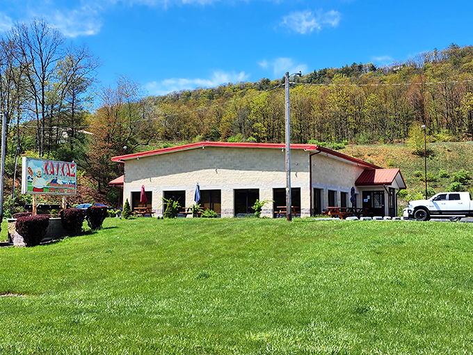Nestled against Pennsylvania's rolling hills, Kavkaz Restaurant's modest exterior belies the culinary journey waiting inside. The red-trimmed roof signals: adventure ahead!