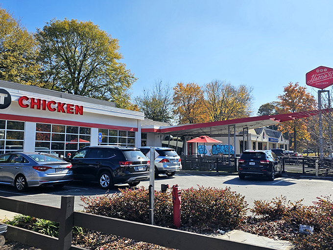 The former gas station's transformation into a hot chicken haven is architectural poetry&mdash;white walls with bold red accents promising fiery delights within.