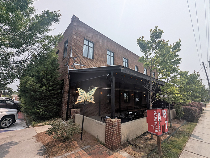 The unassuming brick exterior with its golden butterfly emblem promises culinary metamorphosis inside. Like finding a secret clubhouse for grown-ups with good taste.