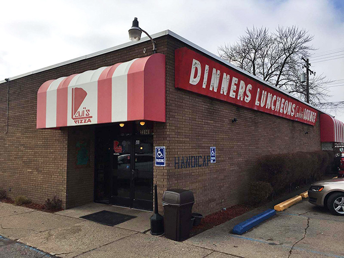 The unassuming exterior of Loui's Pizza proves once again that culinary treasures often hide in plain sight. Michigan's pizza pilgrims know: it's what's inside that counts.