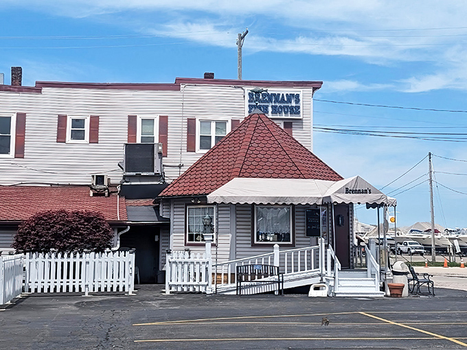 The unassuming exterior of Brennan's Fish House stands like a maritime sentry, its distinctive red-roofed entrance beckoning hungry travelers with the promise of Lake Erie's finest.