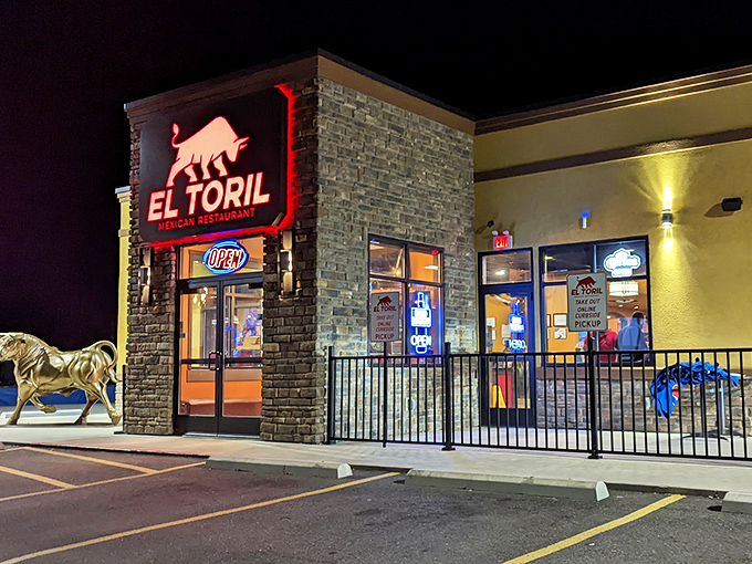 The glowing red bull sign beckons hungry travelers like a culinary lighthouse in the night. Small-town Ohio, big-time flavors await inside.