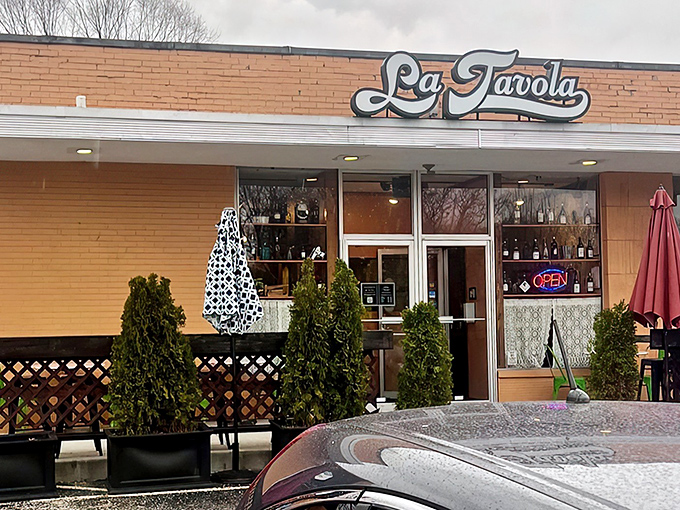 The unassuming exterior of La Tavola belies the culinary treasures within. Like finding a Lamborghini parked behind a garden shed.