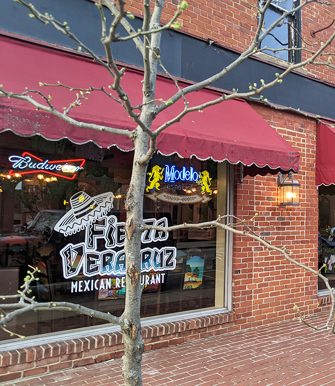The iconic red awning and playful sombrero logo of Fiesta Veracruz beckon like an old friend saying, "Trust me, the tacos are worth it."