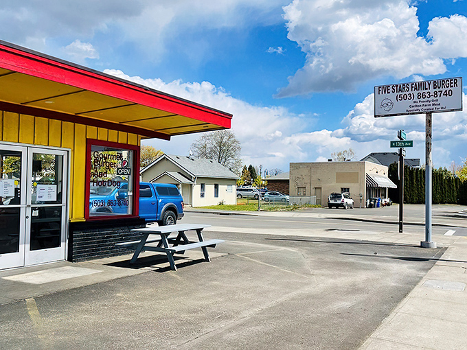 The bright yellow and red exterior of Five Stars Family Burger stands out like a culinary lighthouse in Cornelius, beckoning hungry travelers with its no-frills charm.