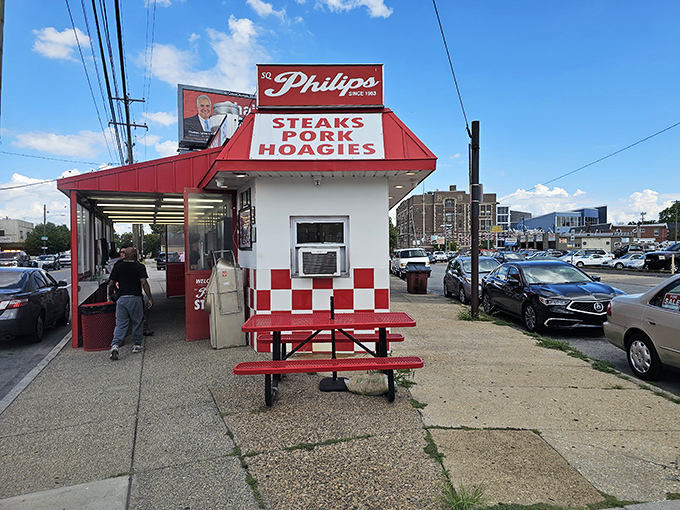The red-and-white checkered beacon of South Philly stands proud against the blue sky, a siren call to cheesesteak pilgrims from across Pennsylvania.