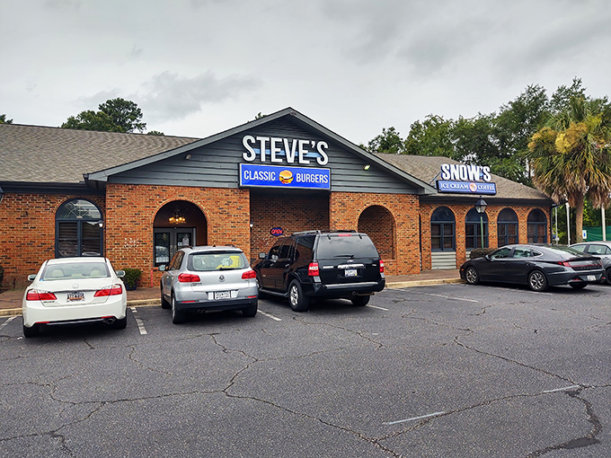 The unassuming brick exterior of Steve's Classic Burgers might not stop traffic, but the packed parking lot tells the real story. Burger paradise awaits inside.