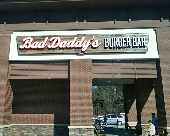 The neon glow of Bad Daddy's sign beckons like a lighthouse for the hungry. This brick-faced burger sanctuary in Greenville promises delicious rebellion in every bite.