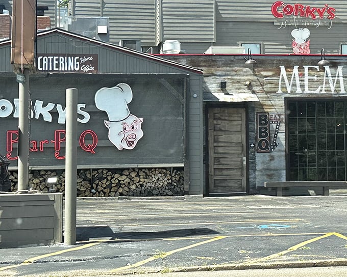 That iconic neon pig sign isn't just calling you in&mdash;it's promising a religious experience. The stacked hickory wood below isn't decoration; it's the secret weapon.