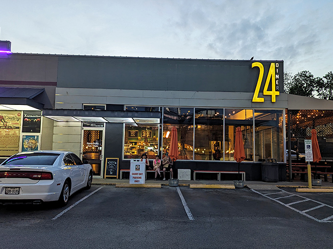 The iconic "24" sign beckons hungry souls like a lighthouse for comfort food cravings, promising salvation at any hour.