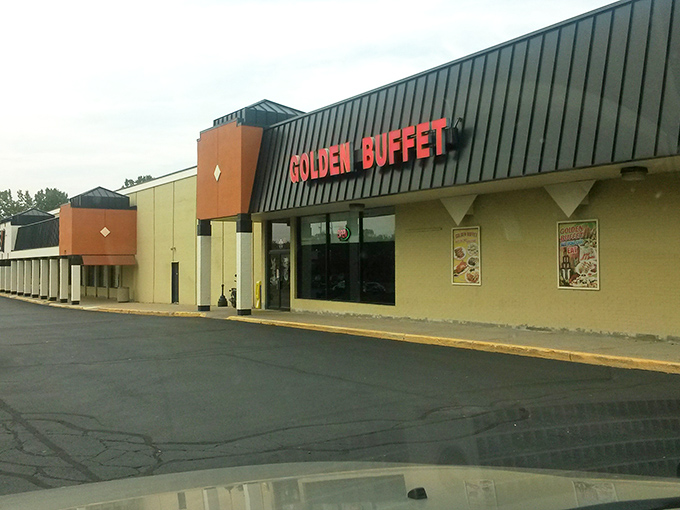 The bright red letters of Golden Buffet beckon from this unassuming strip mall like Vegas neon for the genuinely hungry. No pretense, just promises of abundance inside.
