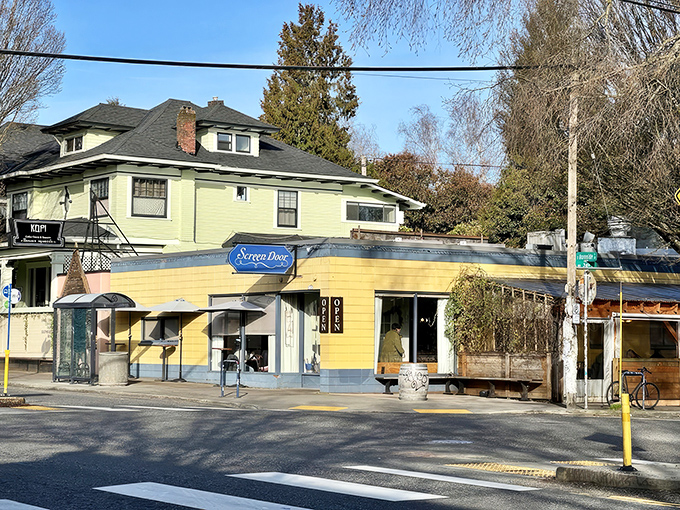 The cheerful yellow exterior of Screen Door Eastside stands like a beacon of Southern comfort in Portland's urban landscape, promising delicious treasures within.