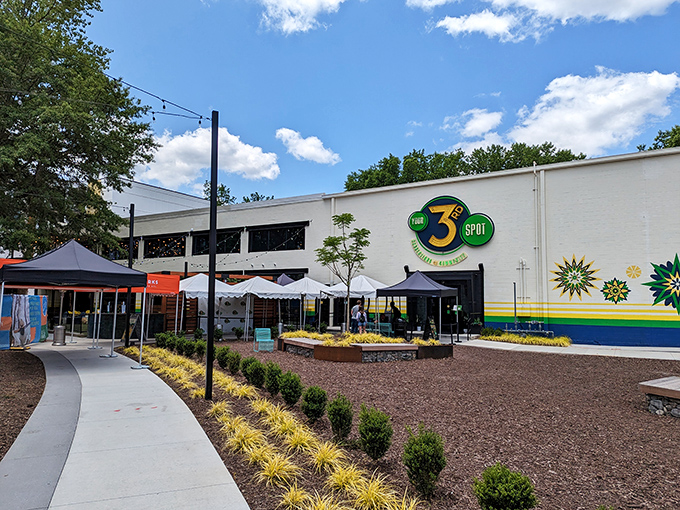 The neon-lit exterior of Your 3rd Spot glows like a beacon for fun-seeking adults. Green and blue hues transform this Atlanta hotspot into a playground after dark.