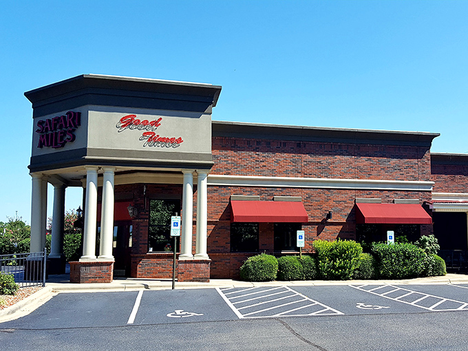 Palm trees in North Carolina? Safari Miles' tropical-meets-brick exterior creates an unexpected oasis that promises culinary adventure before you even step inside.