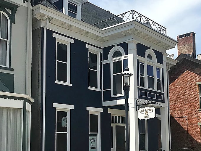 The navy blue fa&ccedil;ade with crisp white trim stands like a culinary lighthouse in downtown Middletown, beckoning hungry travelers with promises of comfort and charm.