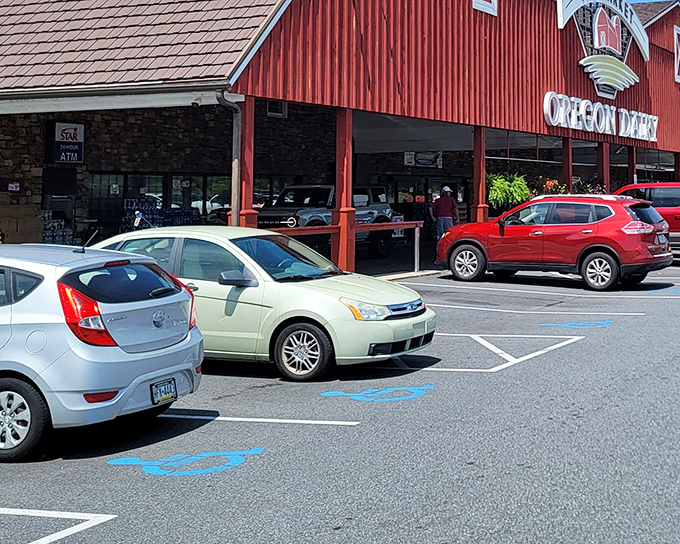 The iconic red barn exterior of Oregon Dairy Restaurant promises farm-fresh delights within those stone walls. Like a culinary lighthouse beckoning hungry travelers home.