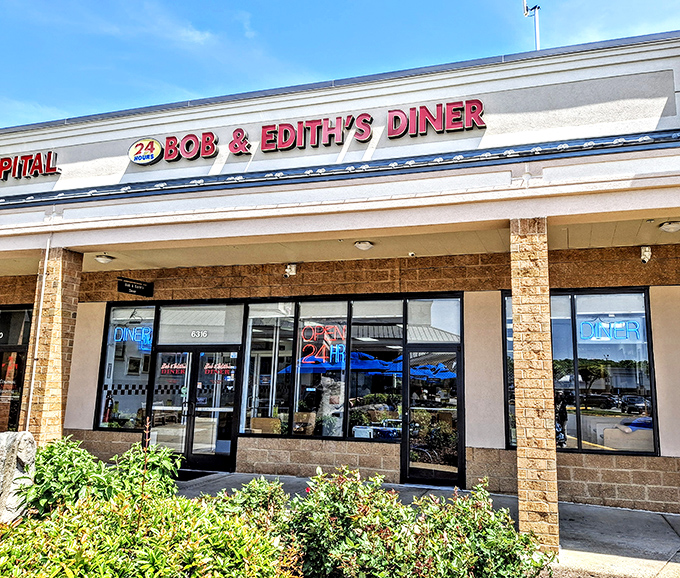 The iconic red signage of Bob & Edith's Diner glows like a beacon for hungry travelers. This 24-hour Springfield institution promises comfort food salvation at any hour.