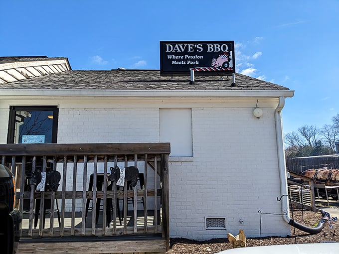 The unassuming white brick exterior of Dave's BBQ hides a smoky paradise within. That sign isn't kidding about passion meeting pork!
