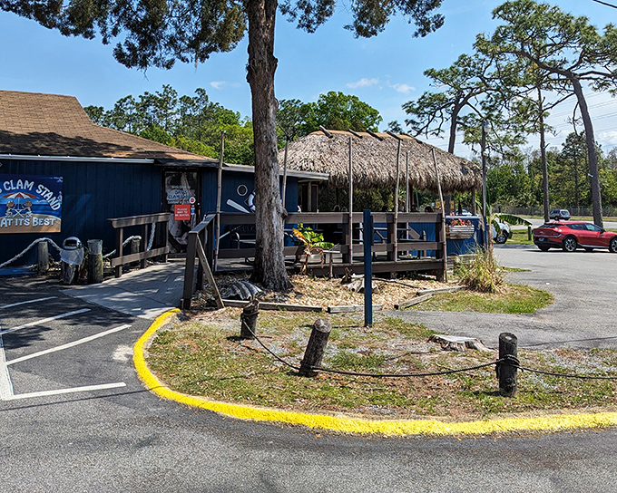 The blue exterior of Dan's Clam Stand with its thatched-roof patio is like finding a secret treasure map to seafood paradise.