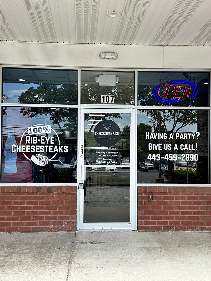 The unassuming storefront speaks volumes: "100% RIB-EYE CHEESESTEAKS" isn't just a promise&mdash;it's a delicious declaration of intent.