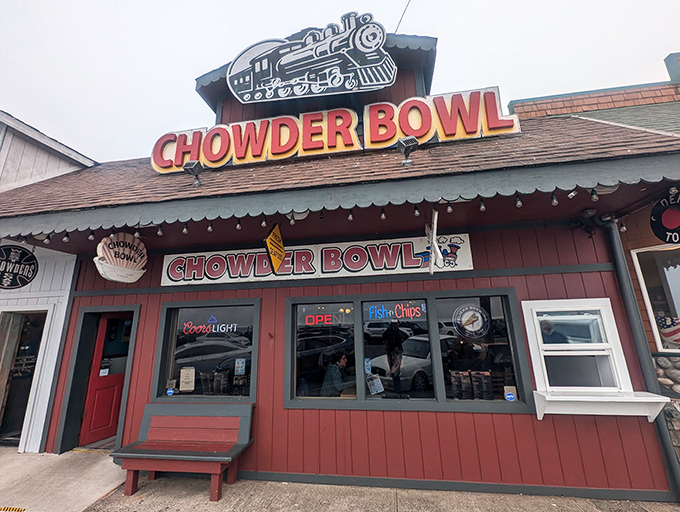 The cheerful red and yellow exterior of Chowder Bowl stands out like a beacon of comfort food hope along Oregon's coastal highway.
